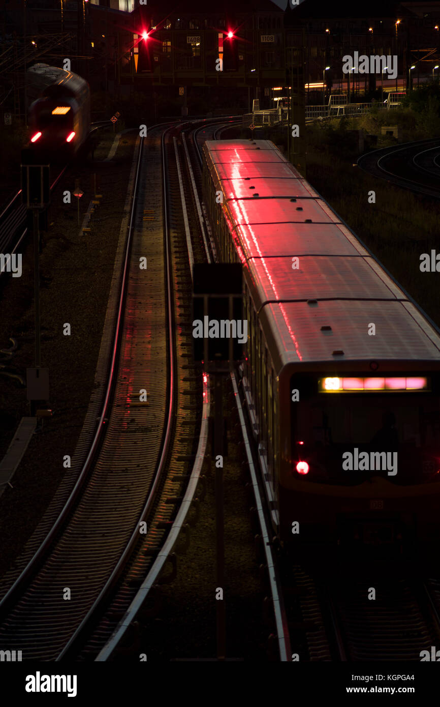 A S-Bahn train stops for a red sign close to Ostbahnhof station, Berlin ...