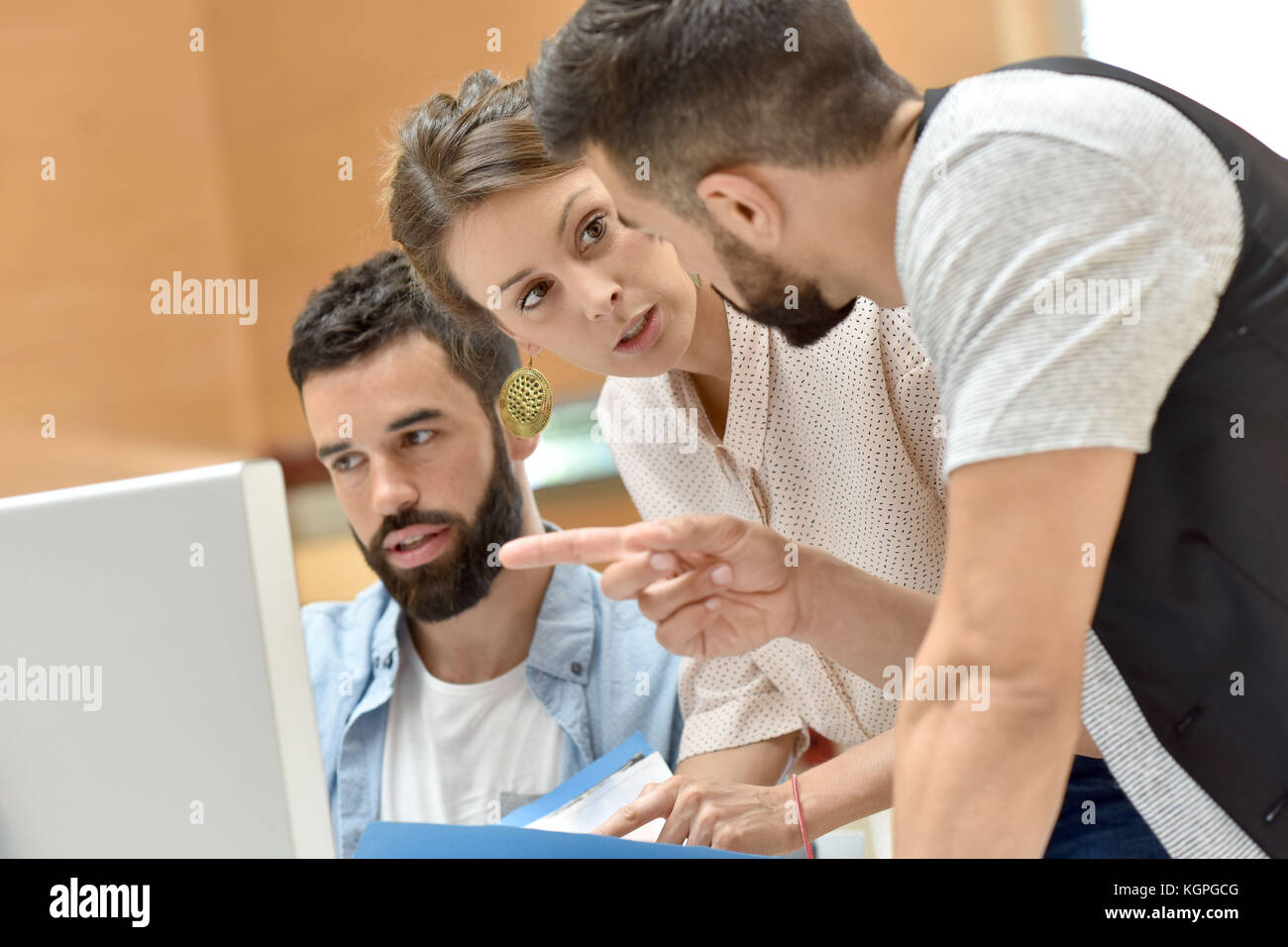 Team of architects working on desktop Stock Photo - Alamy