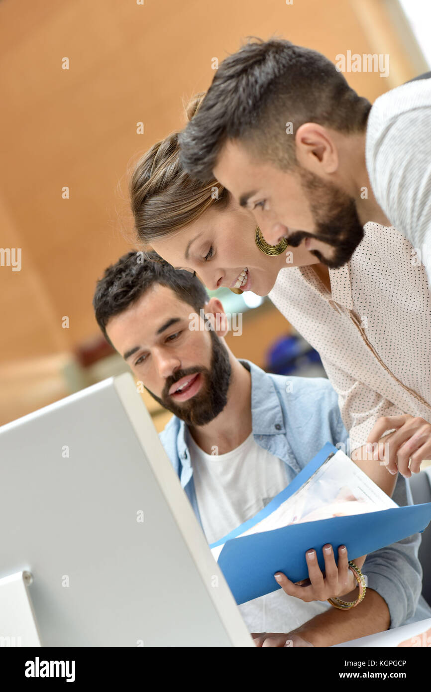 Team of architects working on desktop Stock Photo - Alamy