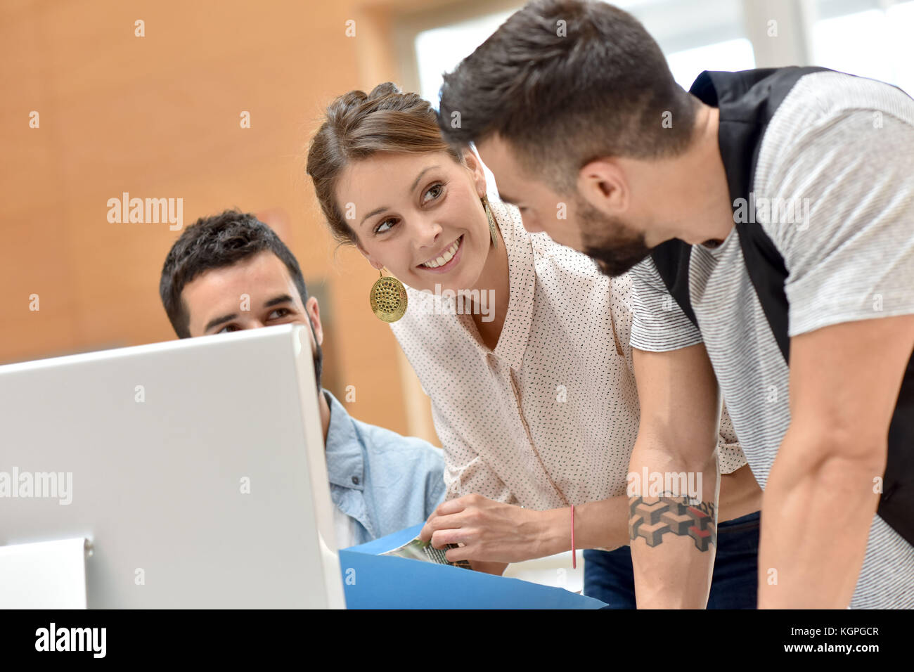 Team of architects working on desktop Stock Photo - Alamy