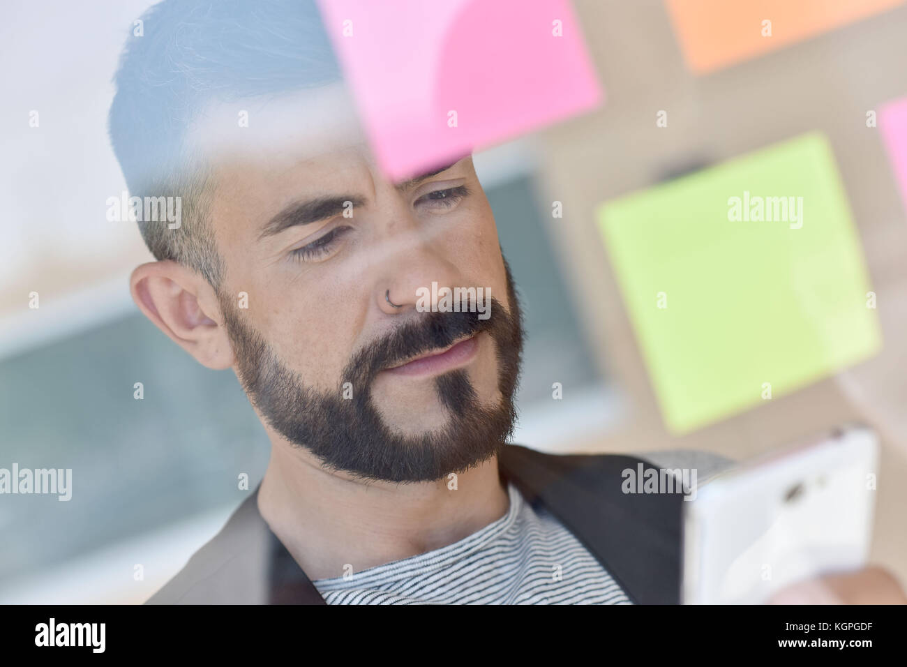 Man scanning notes with smartphone Stock Photo - Alamy