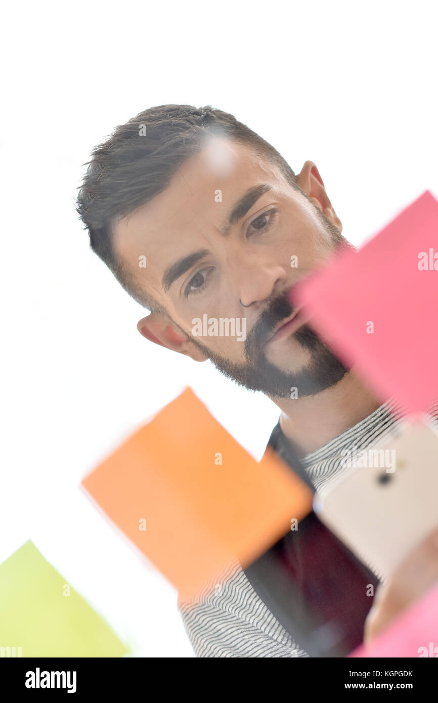 Man scanning notes with smartphone Stock Photo - Alamy