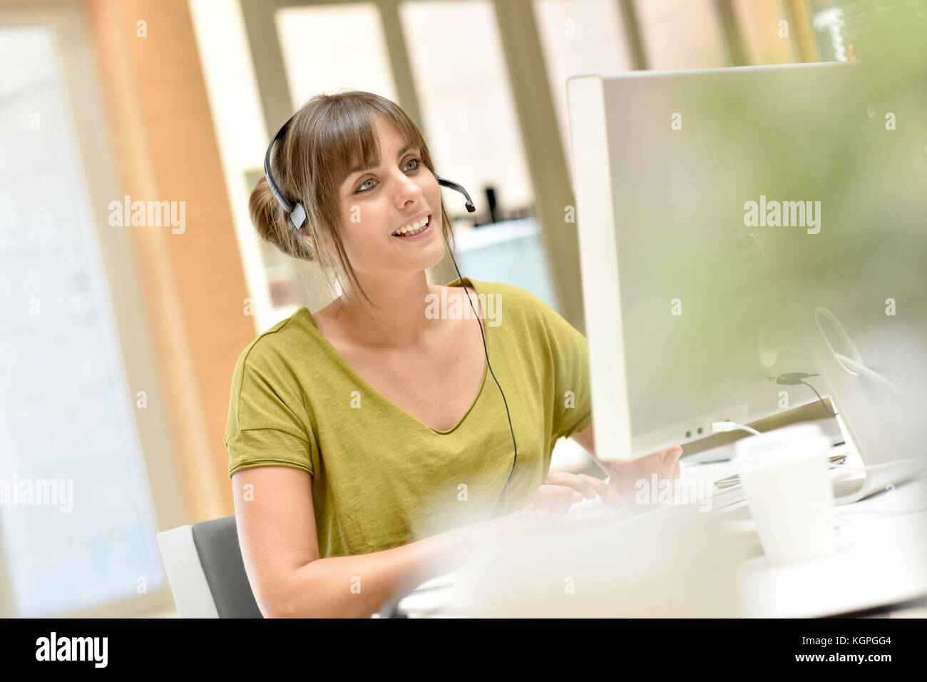 Portrait of teleoperator working in office Stock Photo - Alamy