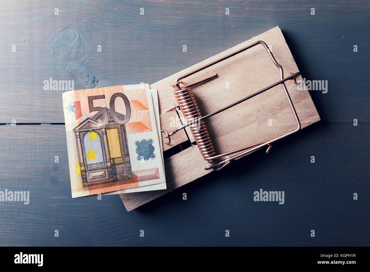 risky money - euro bill in mouse trap Stock Photo - Alamy