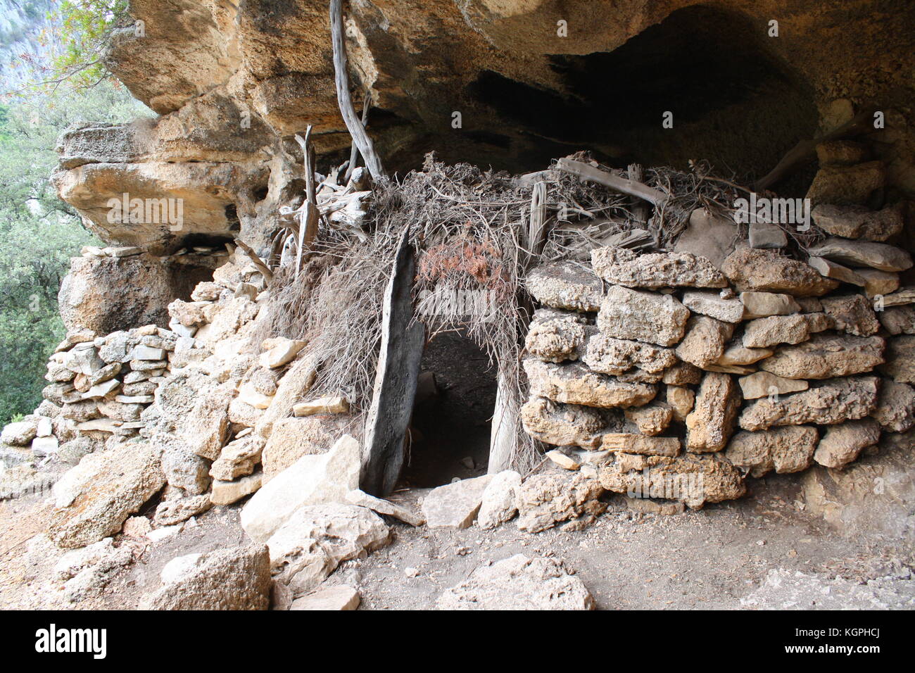 Stone and wood shelters made in cavemen style Stock Photo - Alamy