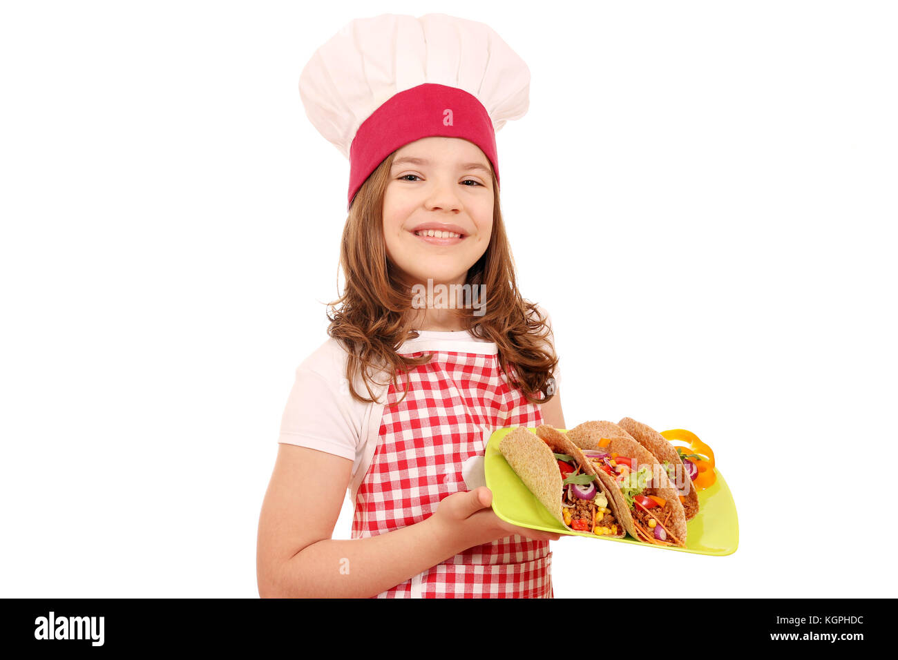 Happy little girl cook with tacos on plate Stock Photo - Alamy