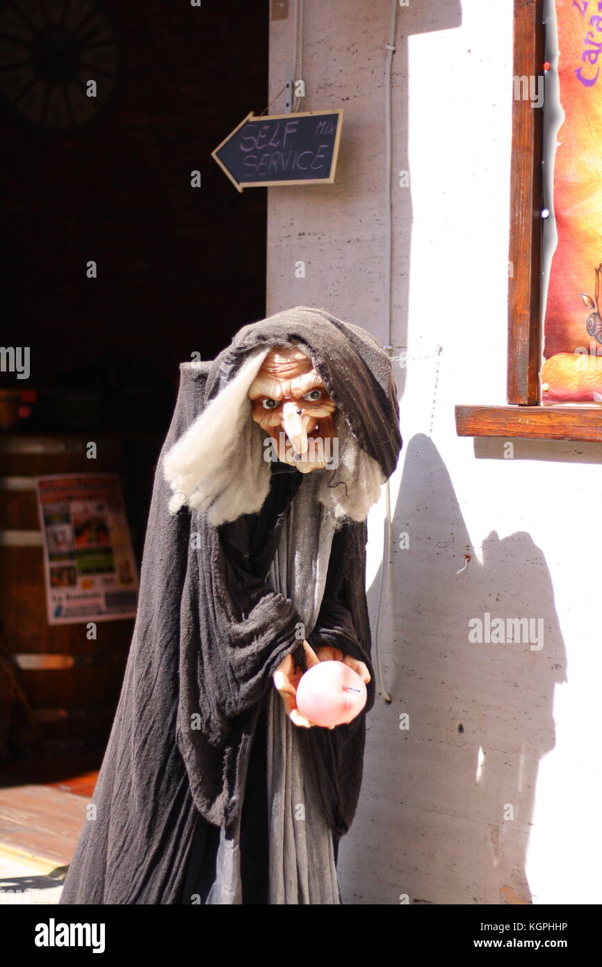 A witch statue on display in front of a shop Stock Photo - Alamy