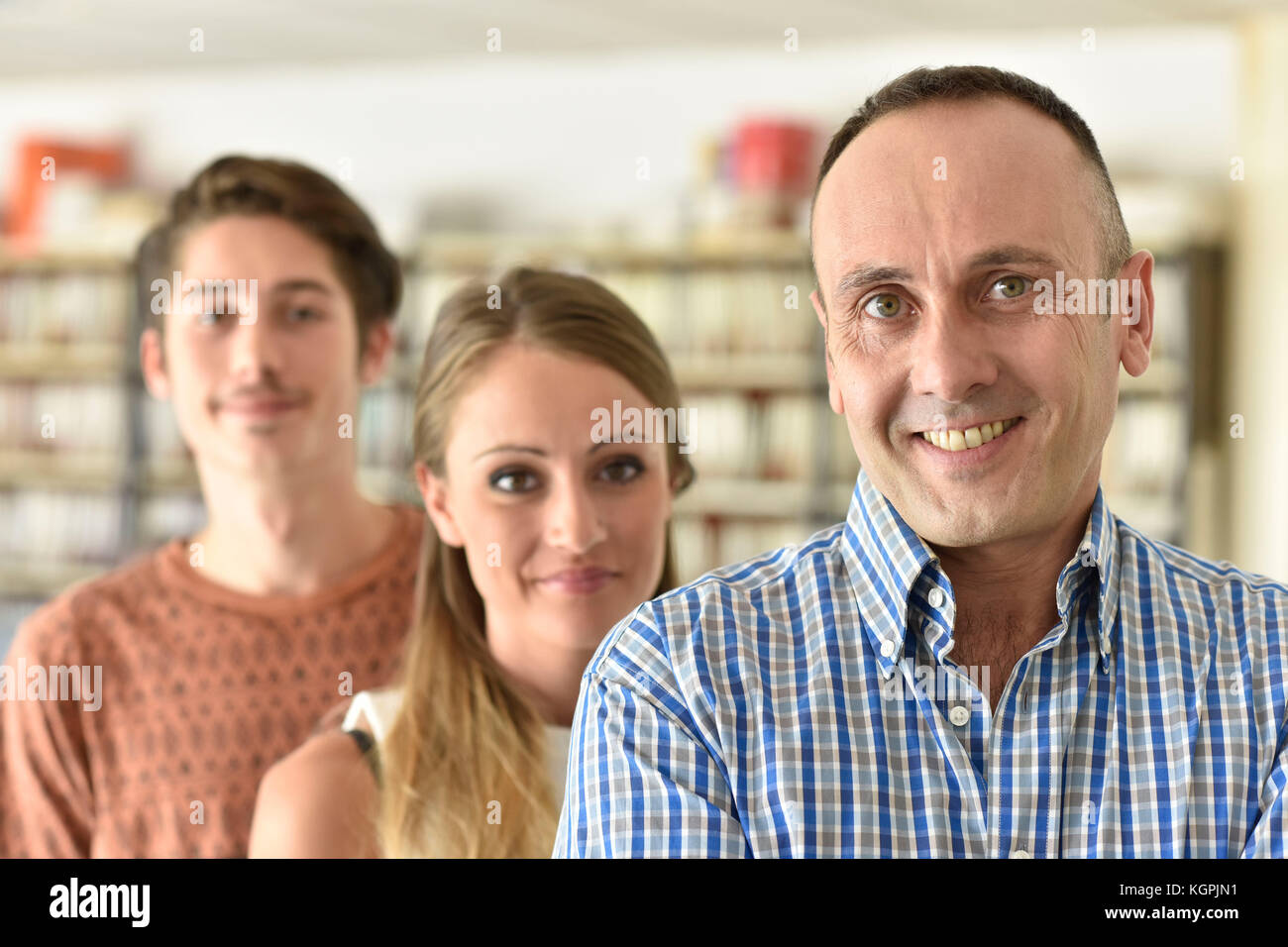 Portrait of teacher with students in designer's office Stock Photo - Alamy