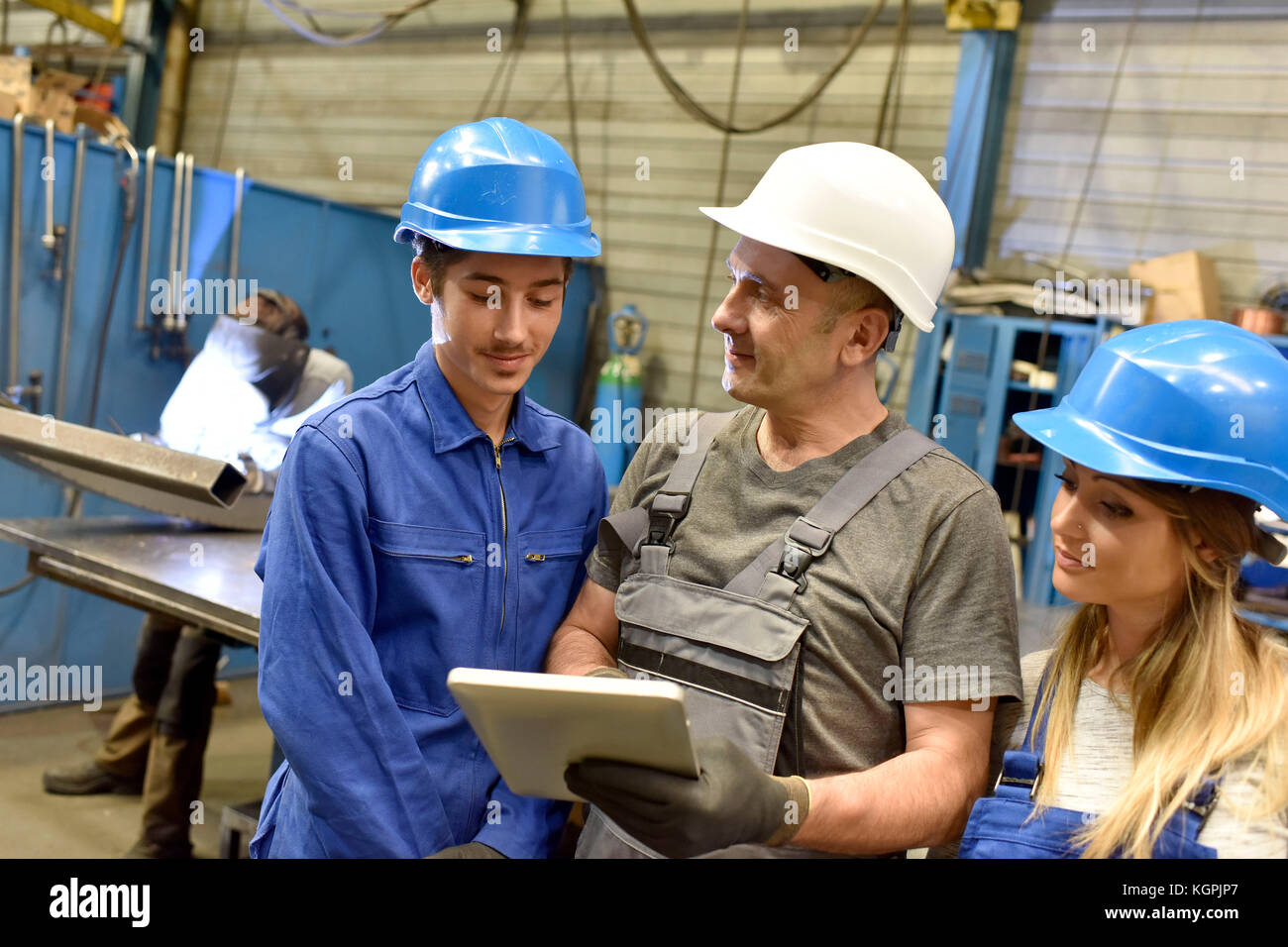 Young people in metallurgy training class Stock Photo - Alamy