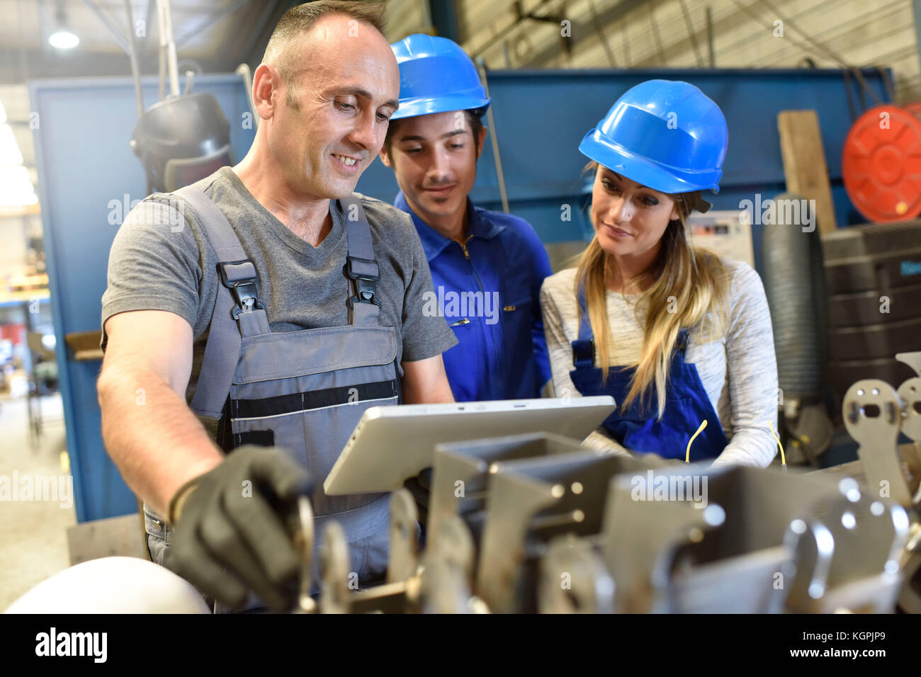 Young people in metallurgy training class Stock Photo - Alamy