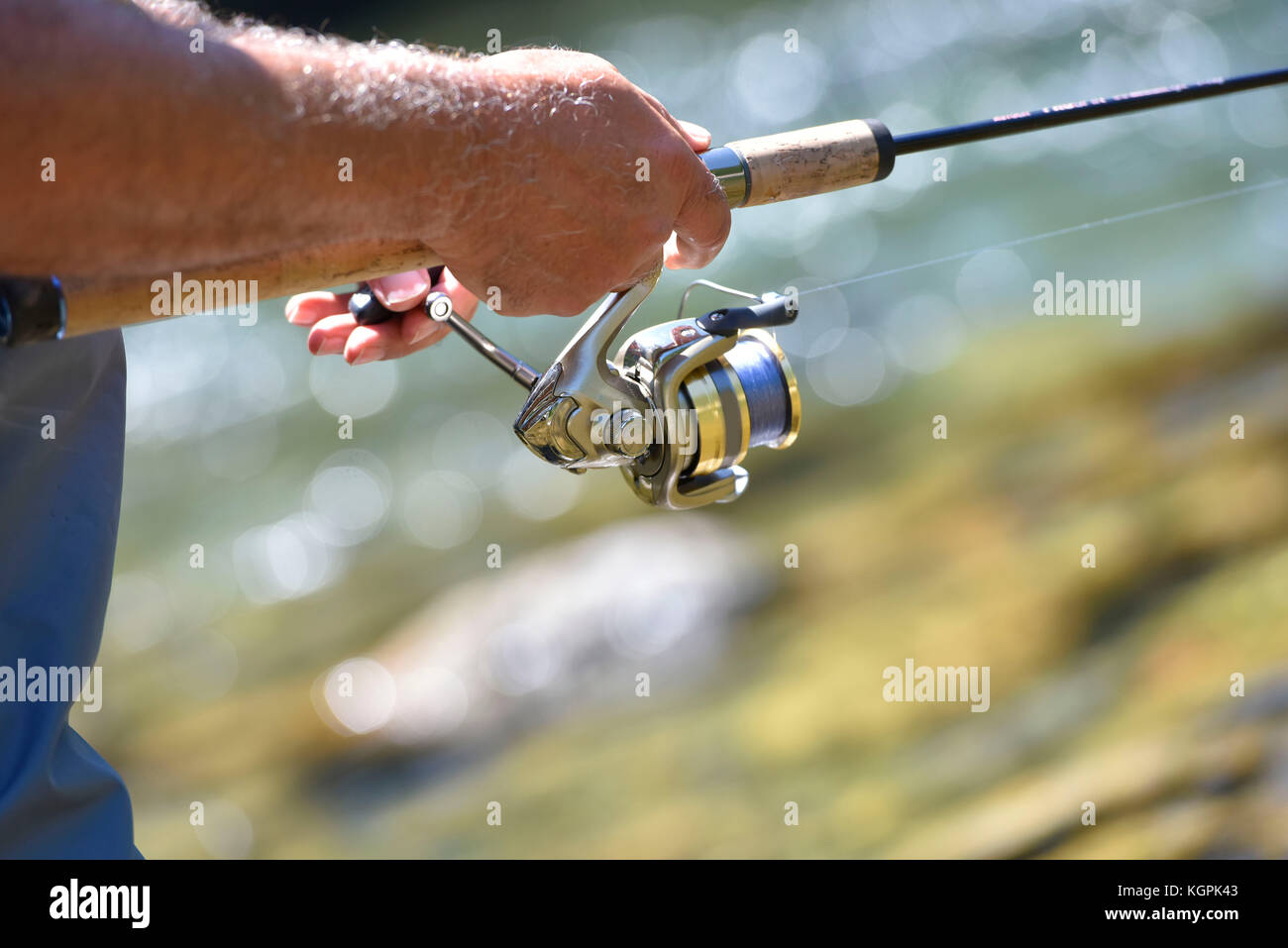 Closeup of fishing reel on rod Stock Photo - Alamy