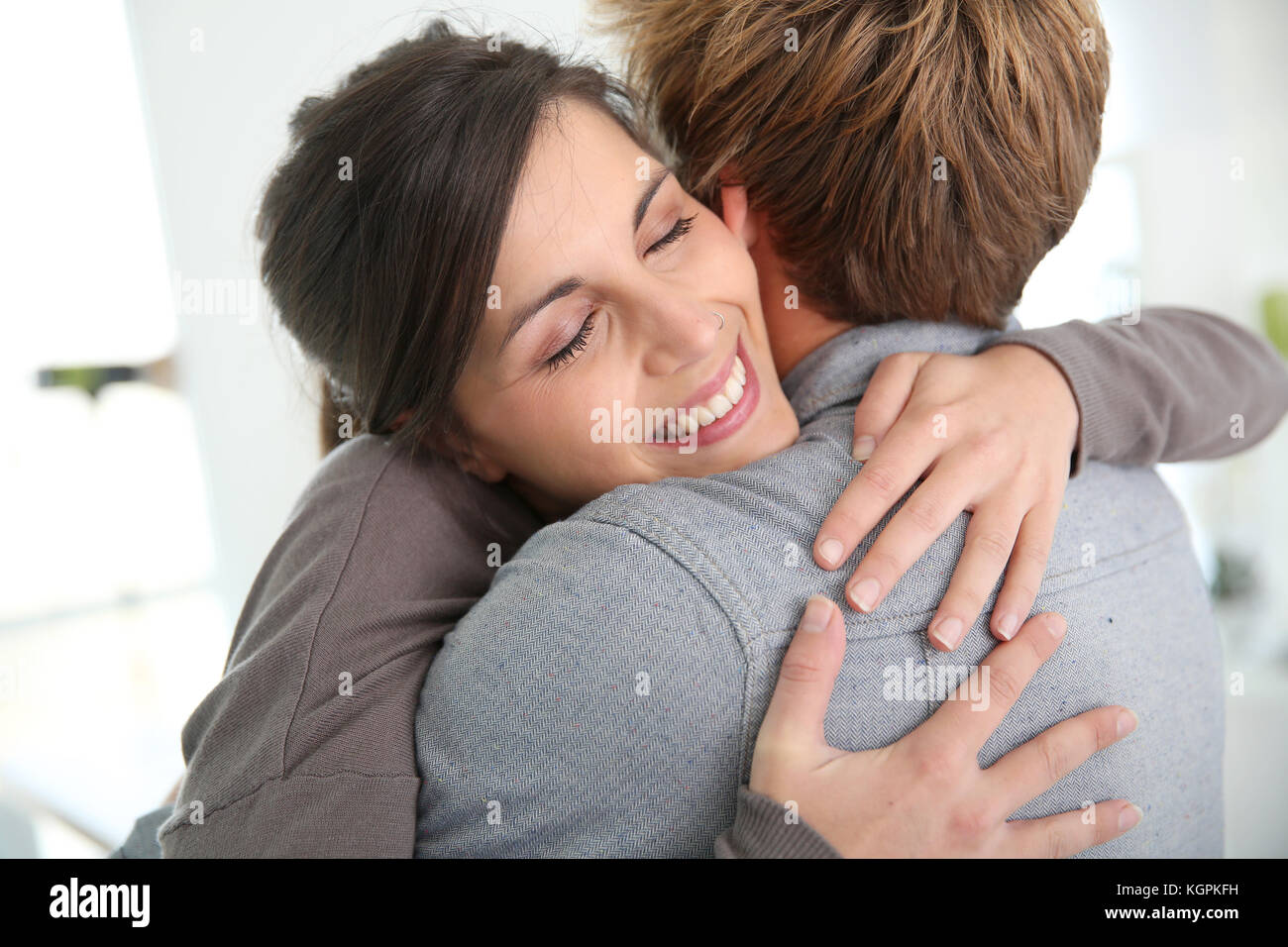 Couple embracing, happy to get back together Stock Photo - Alamy