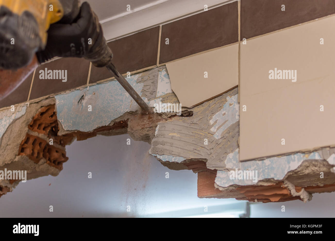Big hummer drill breaking down a wall Stock Photo - Alamy