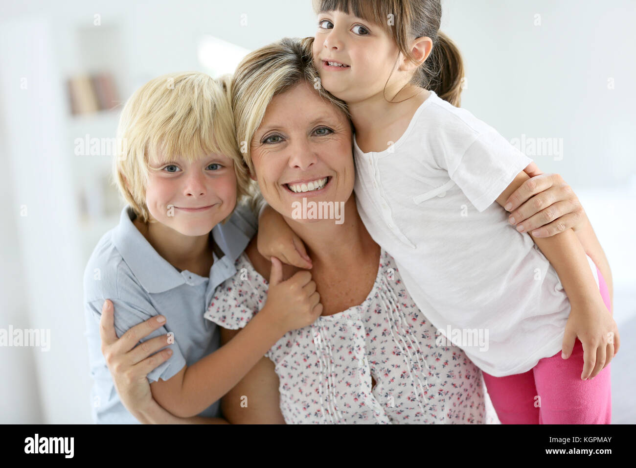 Portrait of happy mother with kids Stock Photo - Alamy