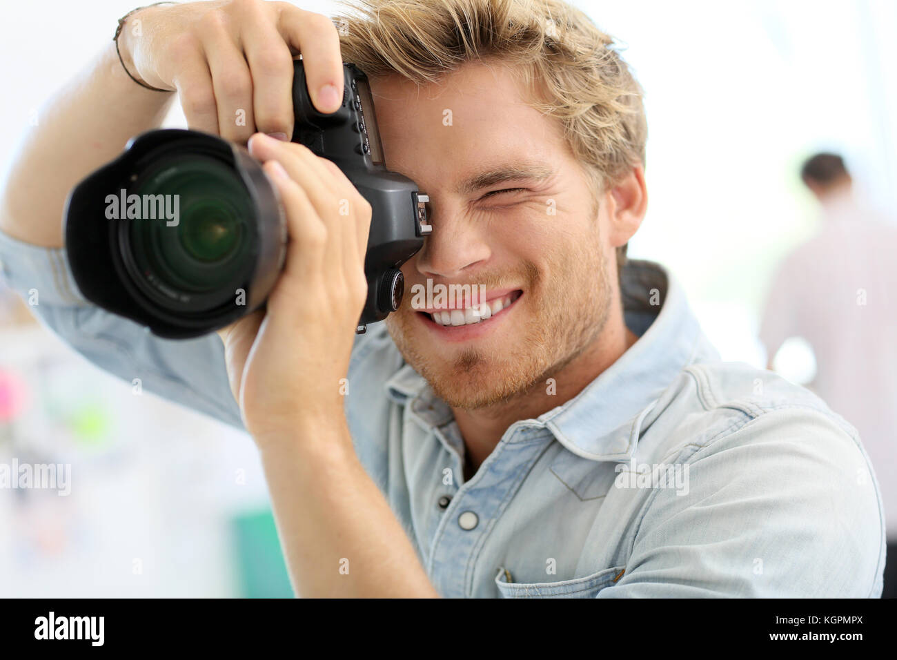 Fashion photographer shooting model in studio Stock Photo - Alamy