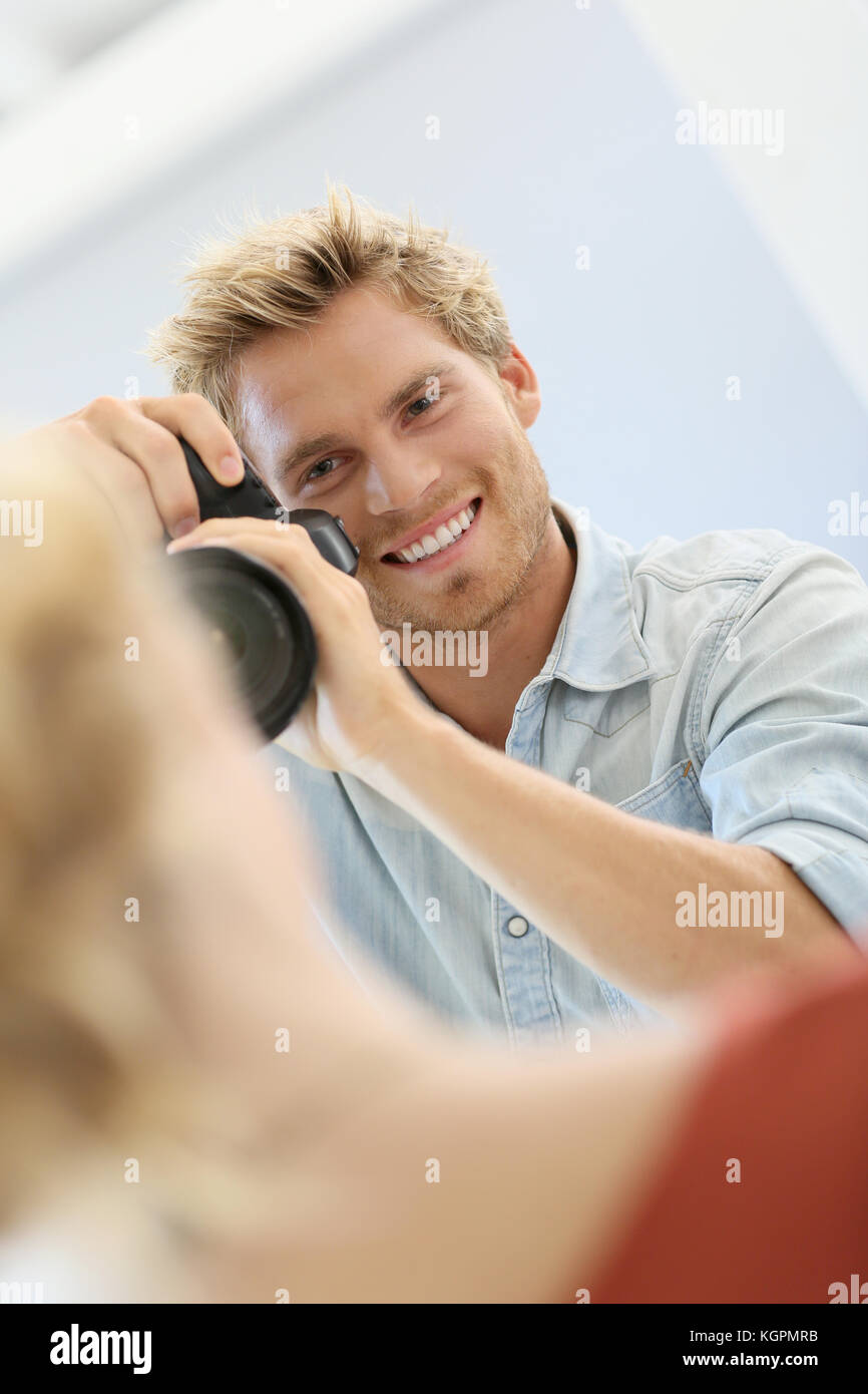 Fashion photographer shooting model in studio Stock Photo - Alamy