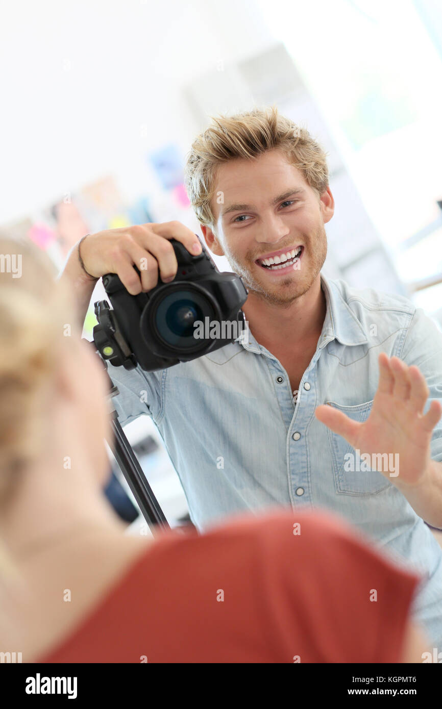 Fashion photographer shooting model in studio Stock Photo - Alamy