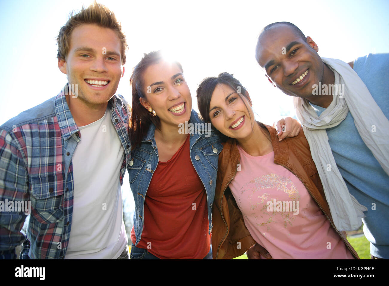 Group of students having fun outside college campus Stock Photo - Alamy