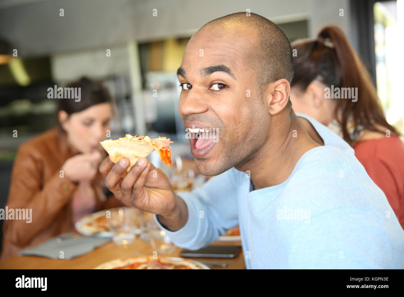 Old man eating pizza hi-res stock photography and images - Alamy