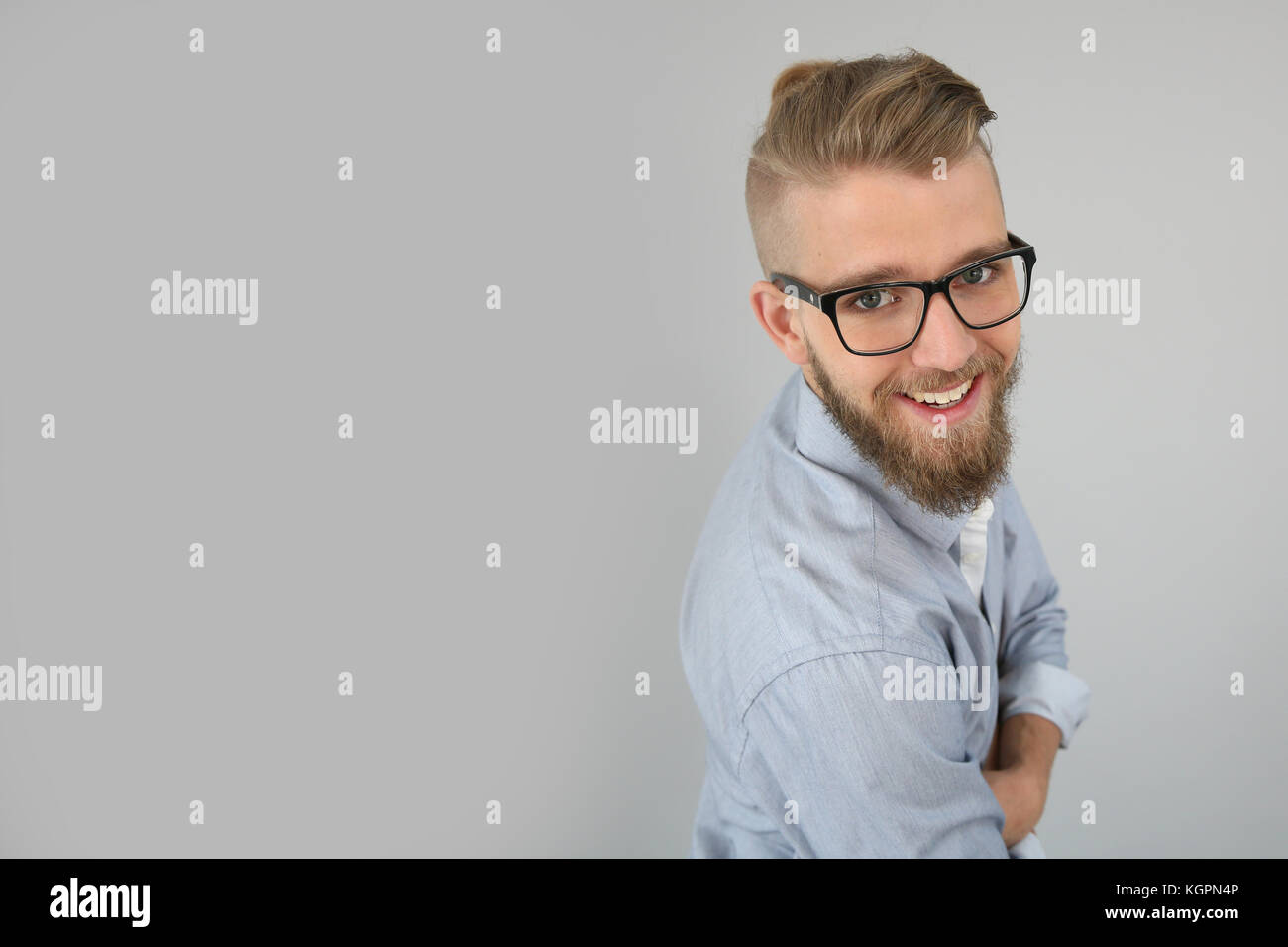 Portrait of smiling guy looking at camera, isolated Stock Photo - Alamy