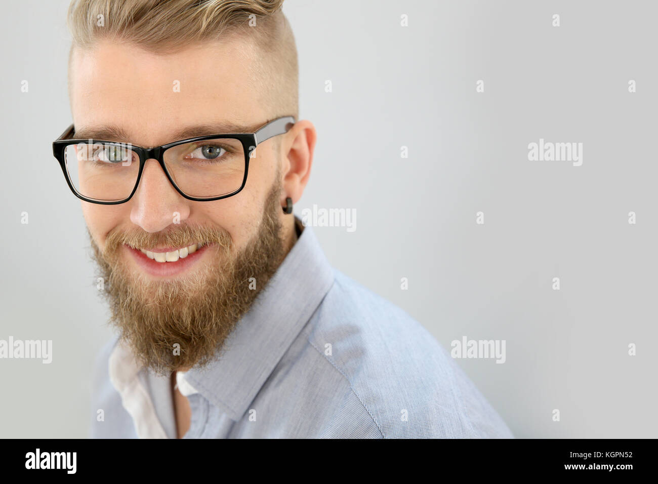 Portrait of trendy guy looking at camera, isolated Stock Photo - Alamy