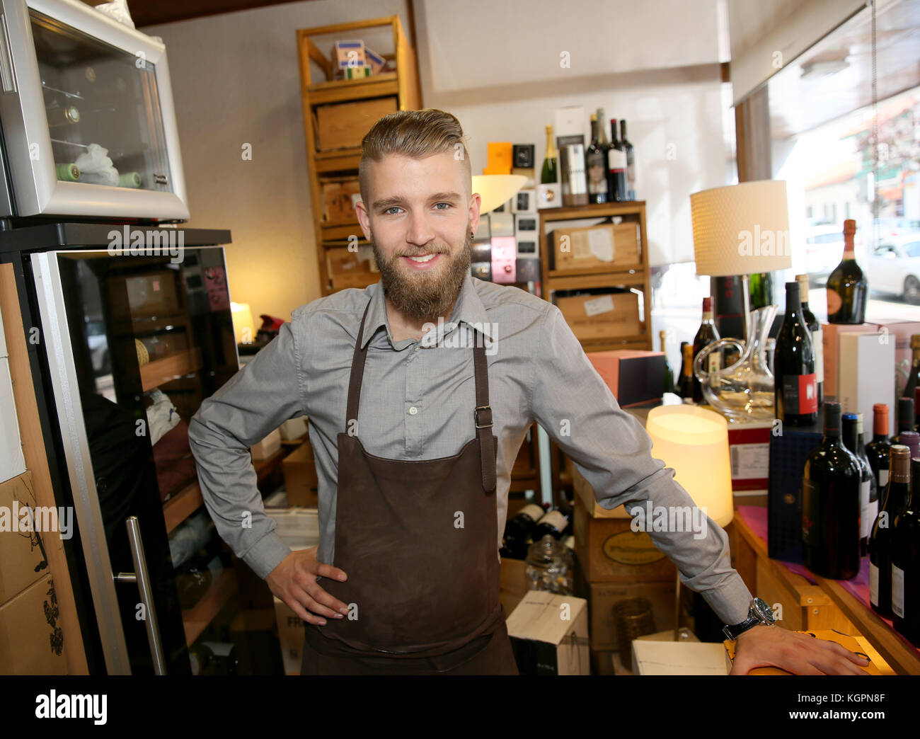 Man working in wine shop Stock Photo - Alamy