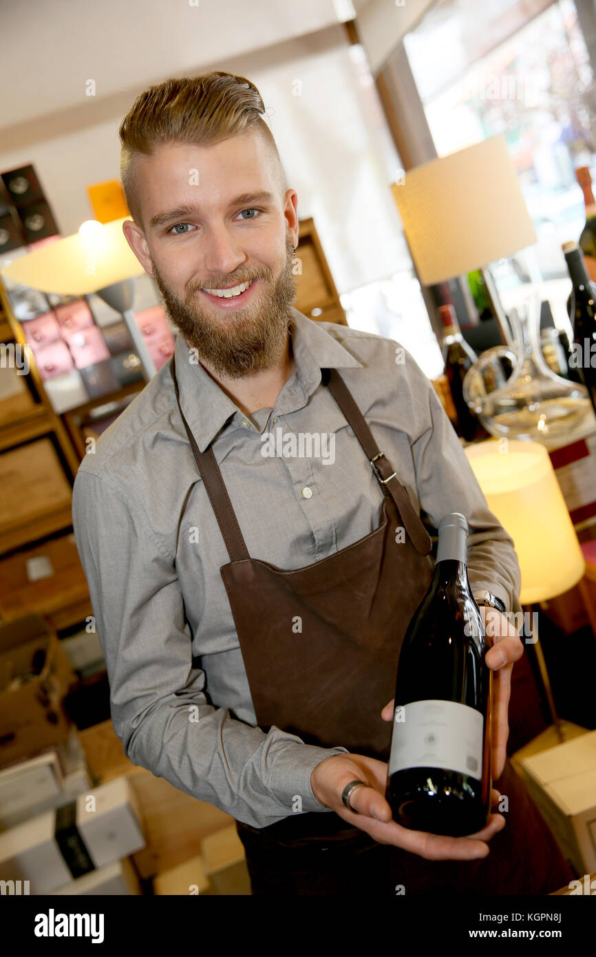 Man working in wine shop Stock Photo - Alamy