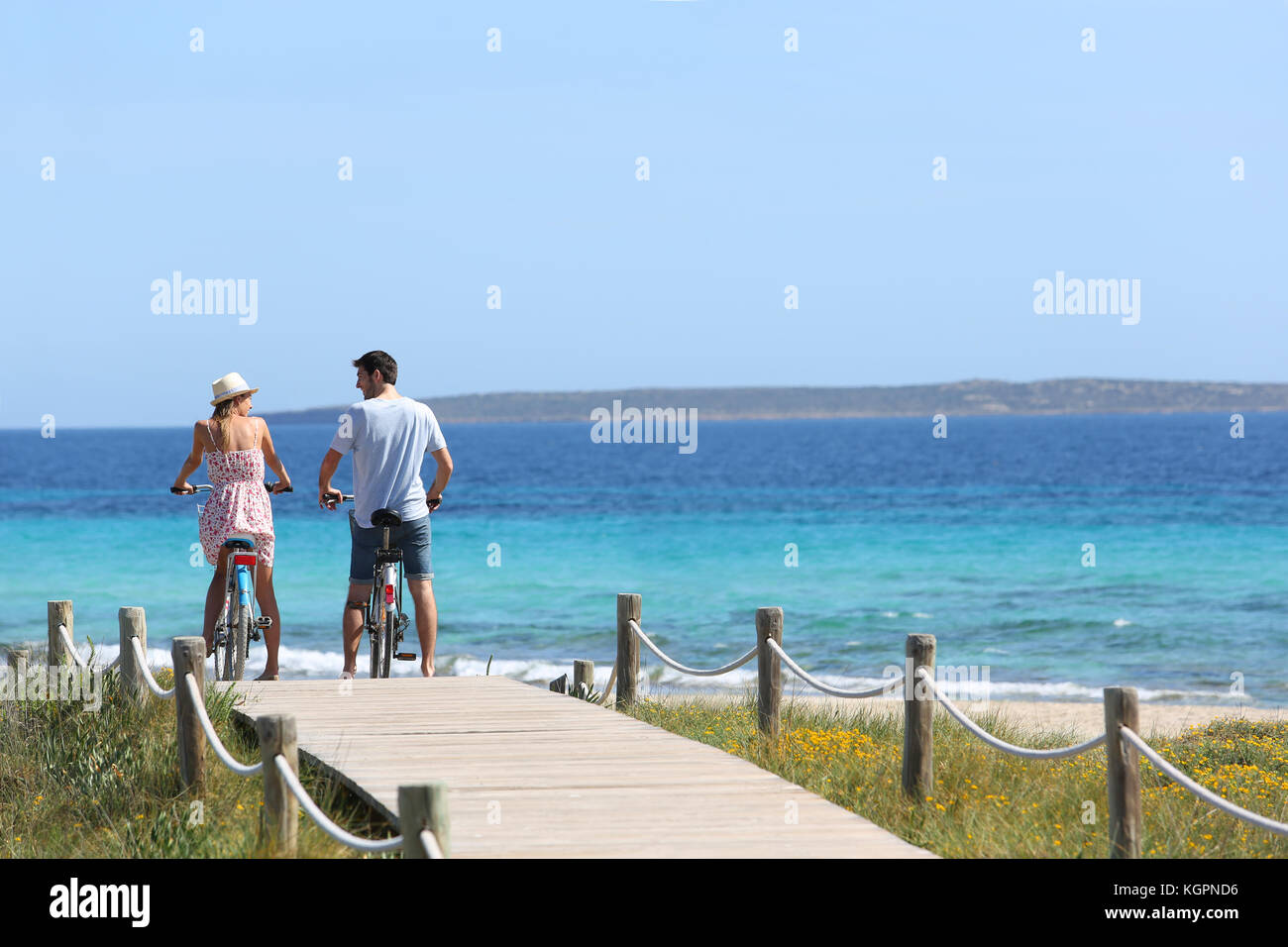 Couple riding bikes on Formentera Island Stock Photo - Alamy
