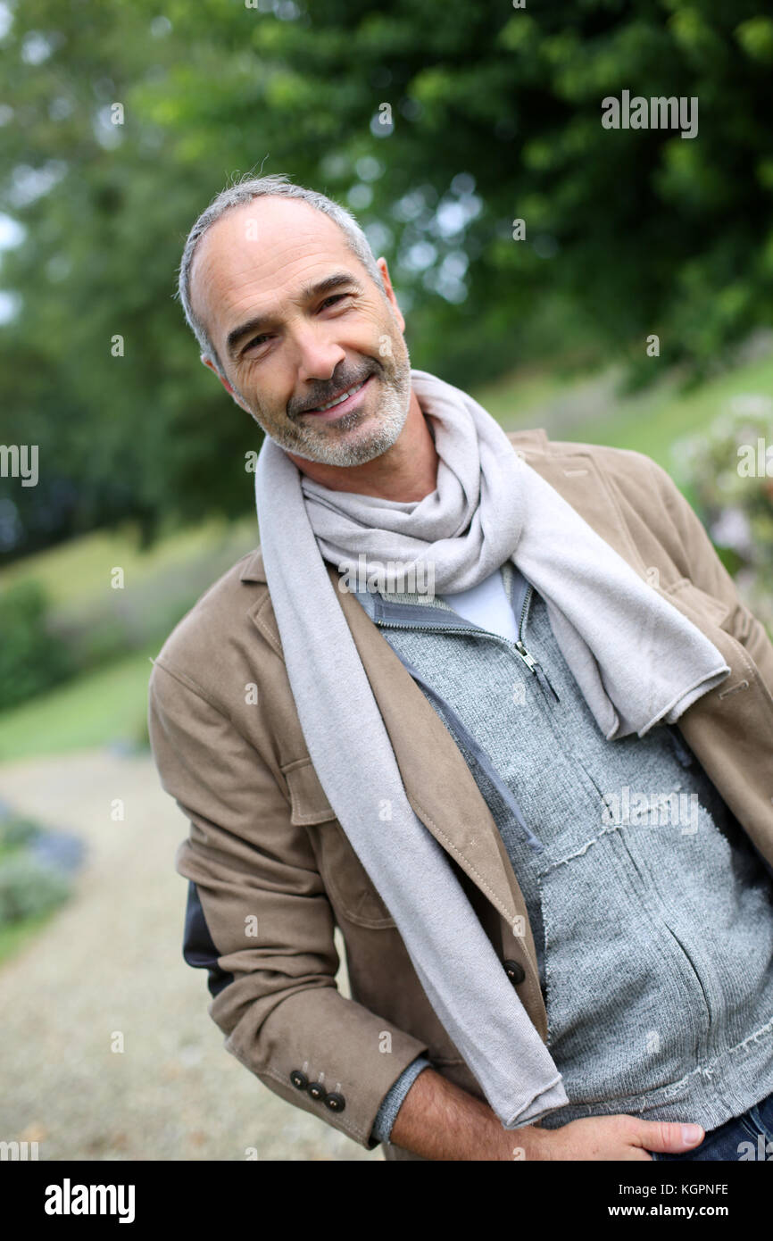 Handsome senior man smiling park hi-res stock photography and images ...