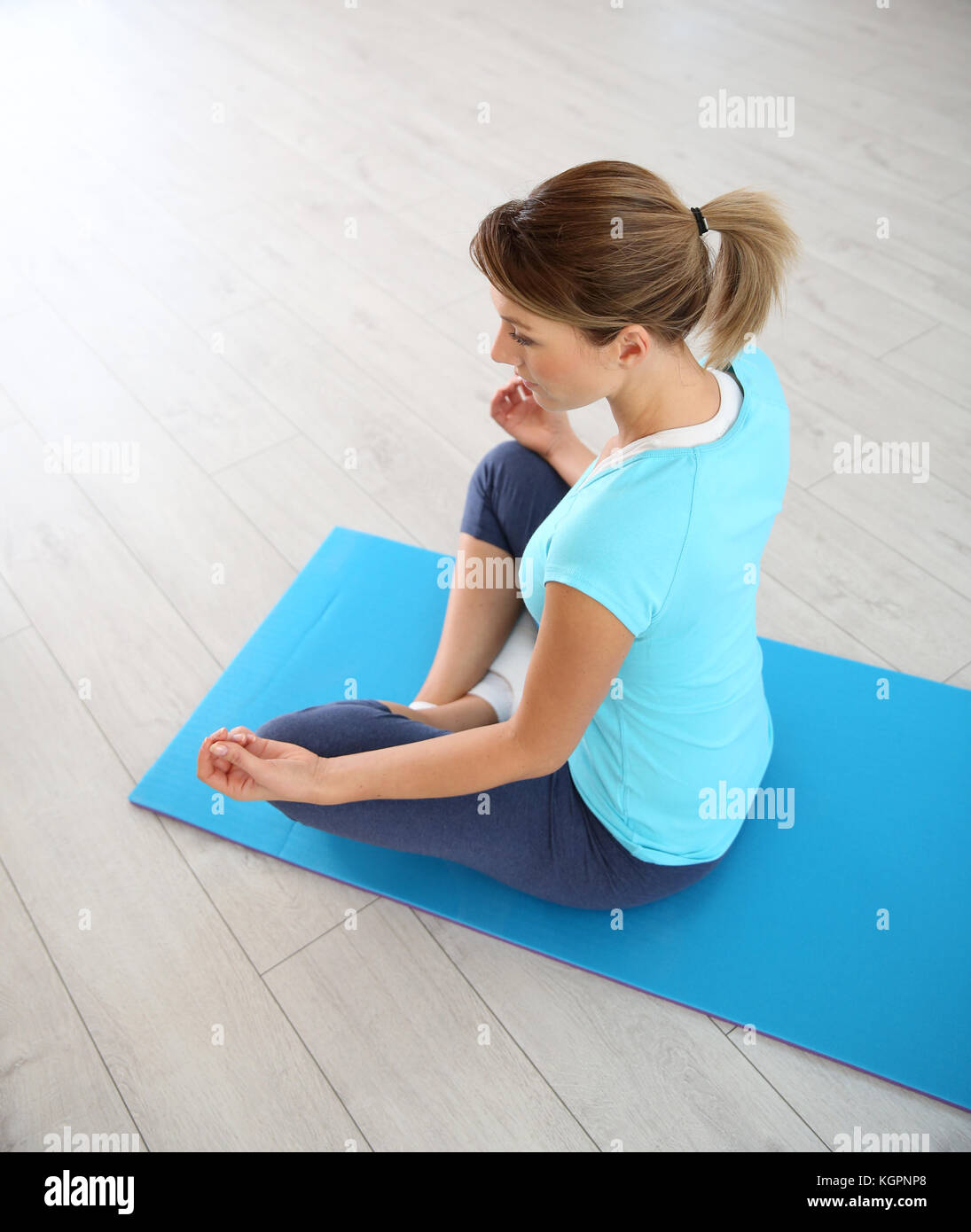 Woman doing yoga exercises Stock Photo - Alamy