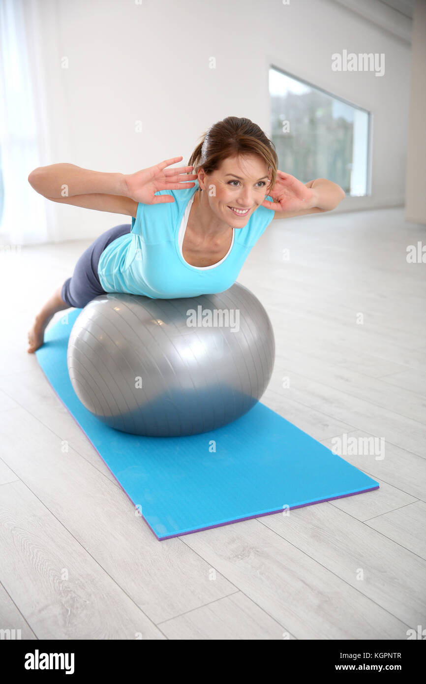 Woman doing pilates and balance exercises Stock Photo - Alamy