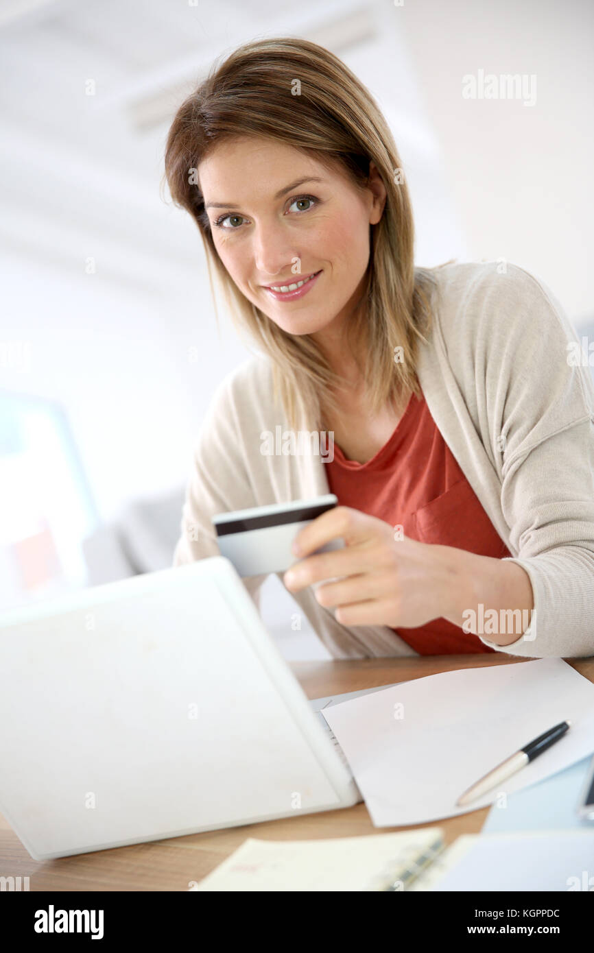 Cheerful middle-aged woman buying on internet Stock Photo - Alamy