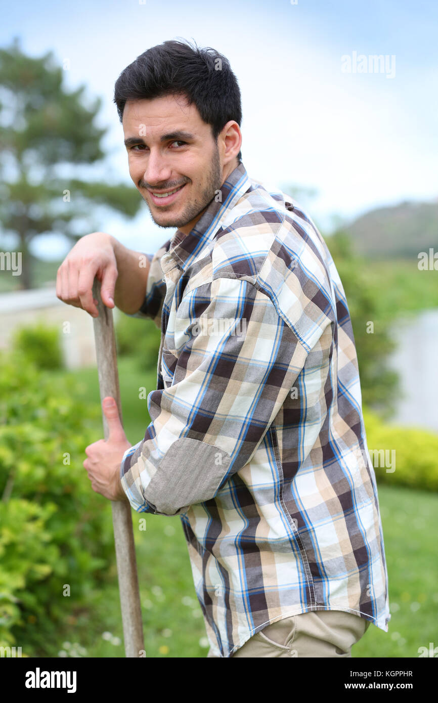 Young man working in garden at springtime Stock Photo - Alamy
