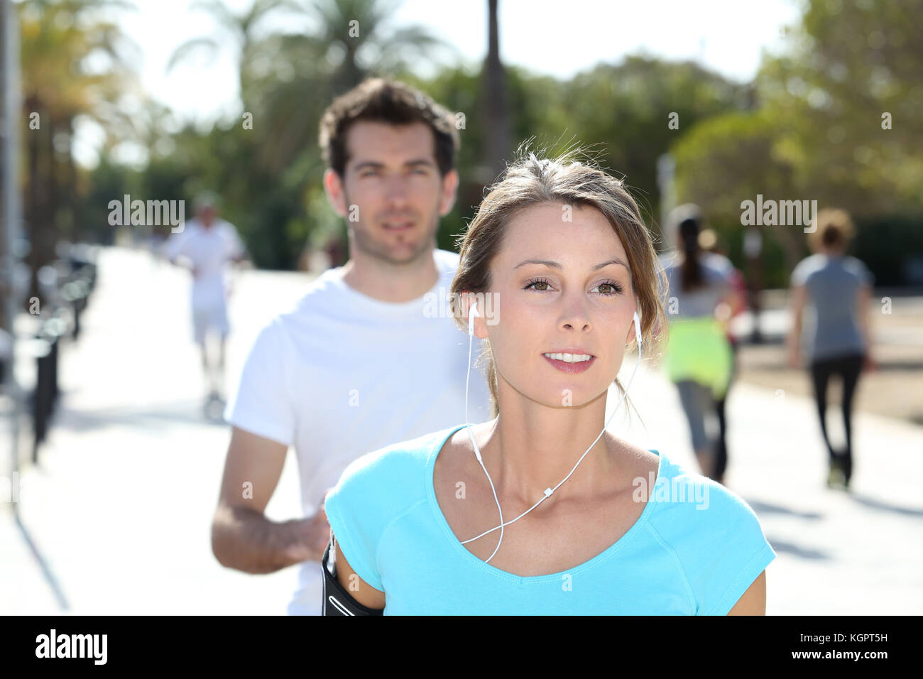 Fitness girl running in the street Stock Photo - Alamy