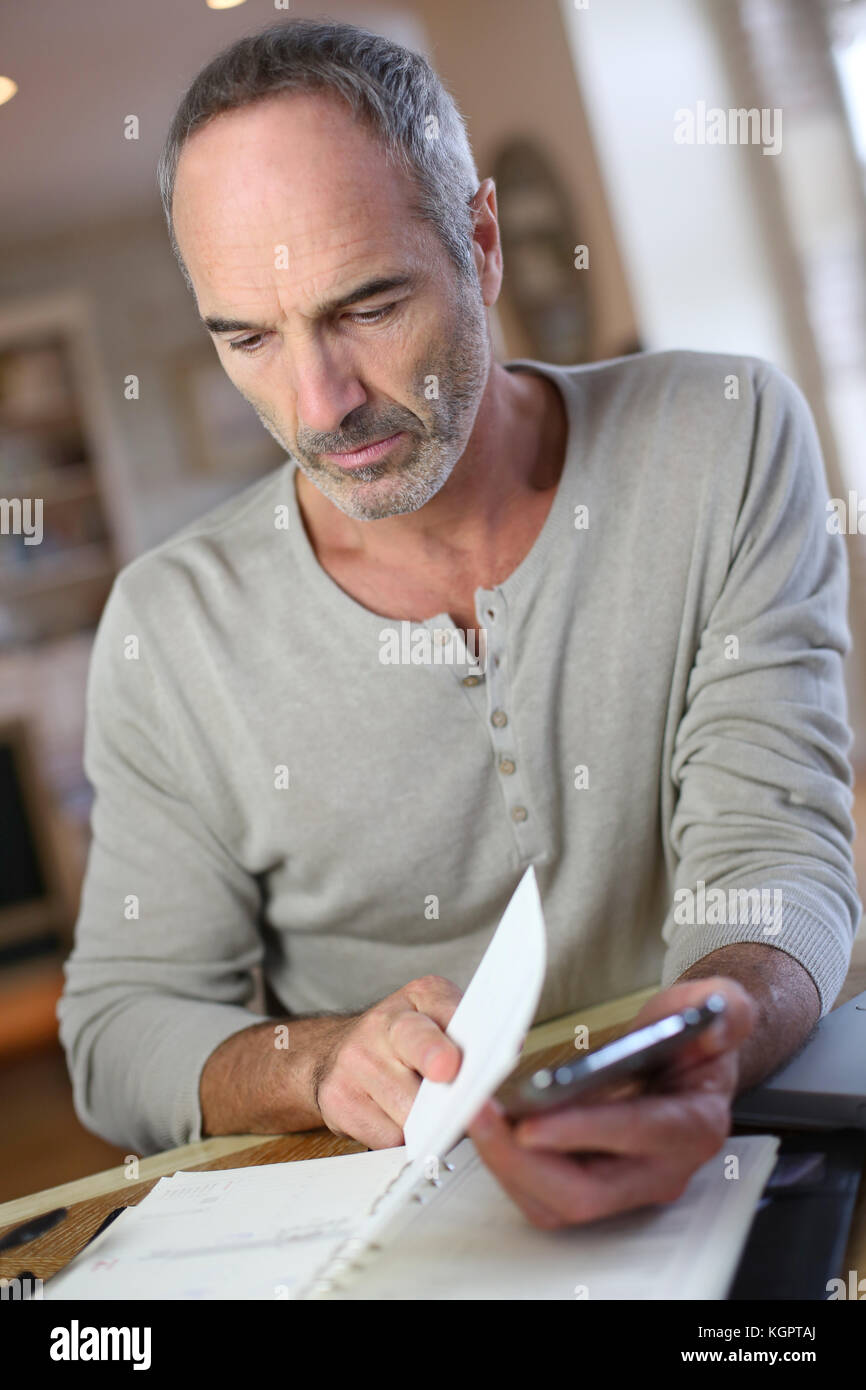 Mature man working from home Stock Photo - Alamy