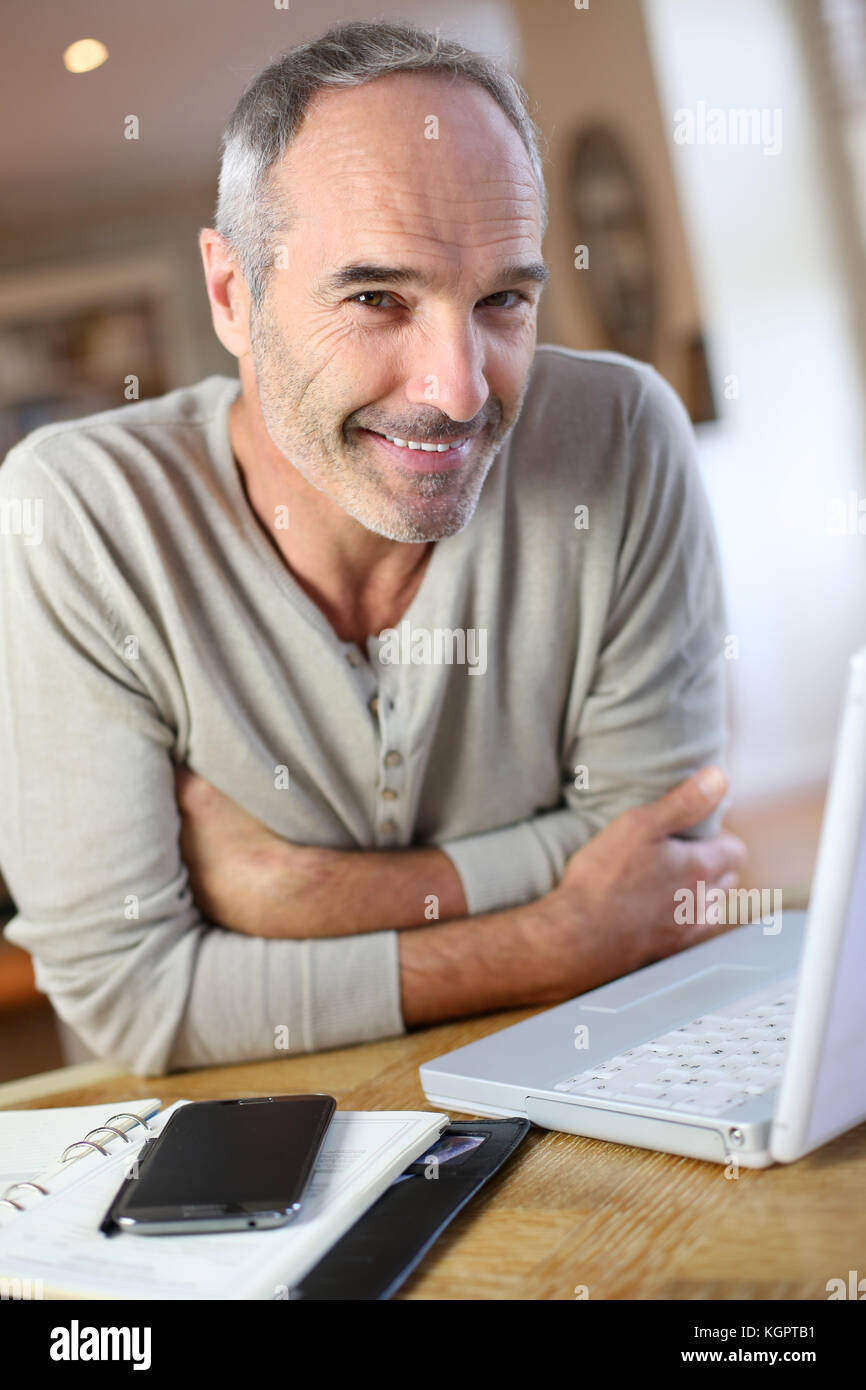 Mature man working from home Stock Photo - Alamy