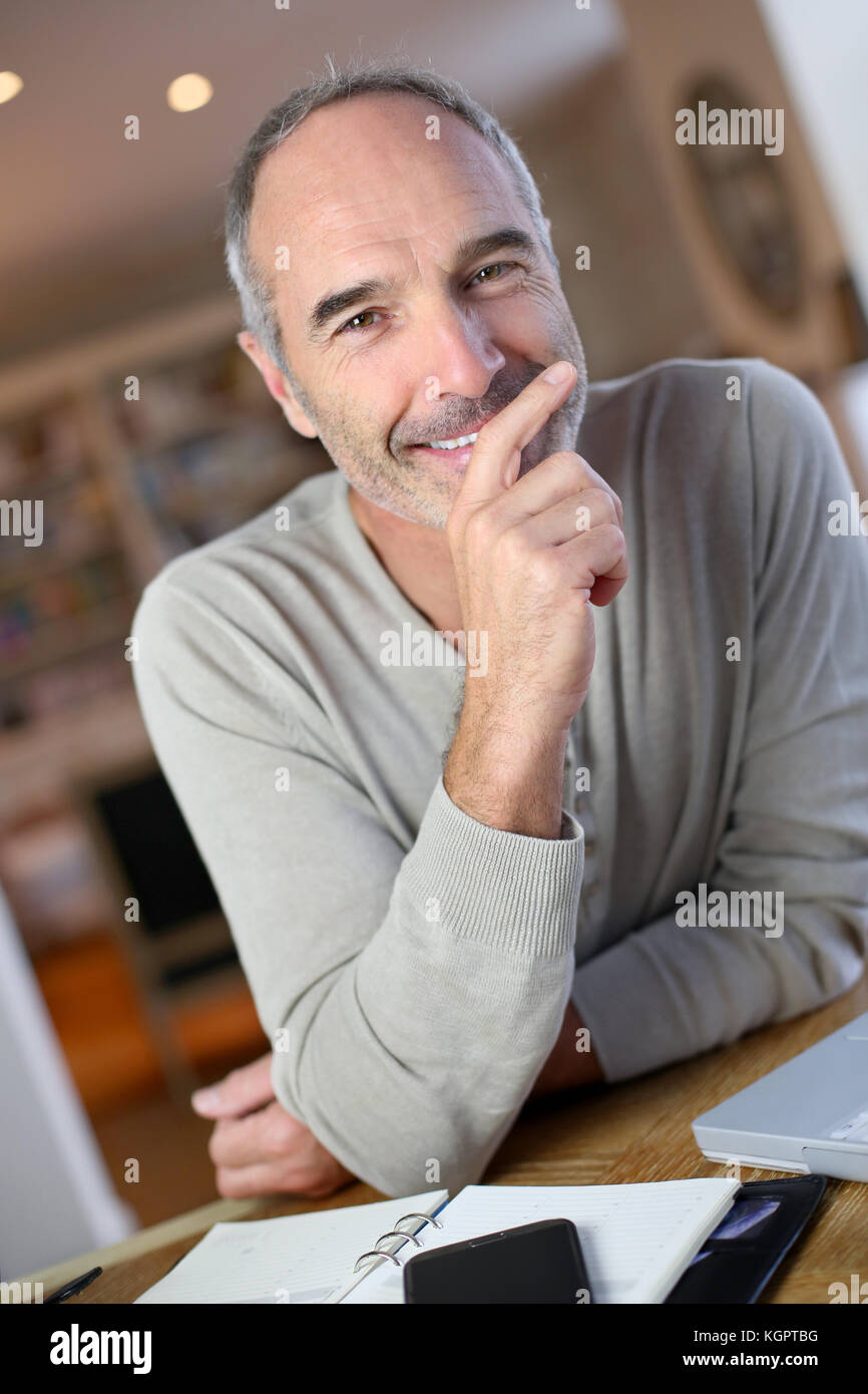 Mature man working from home Stock Photo - Alamy