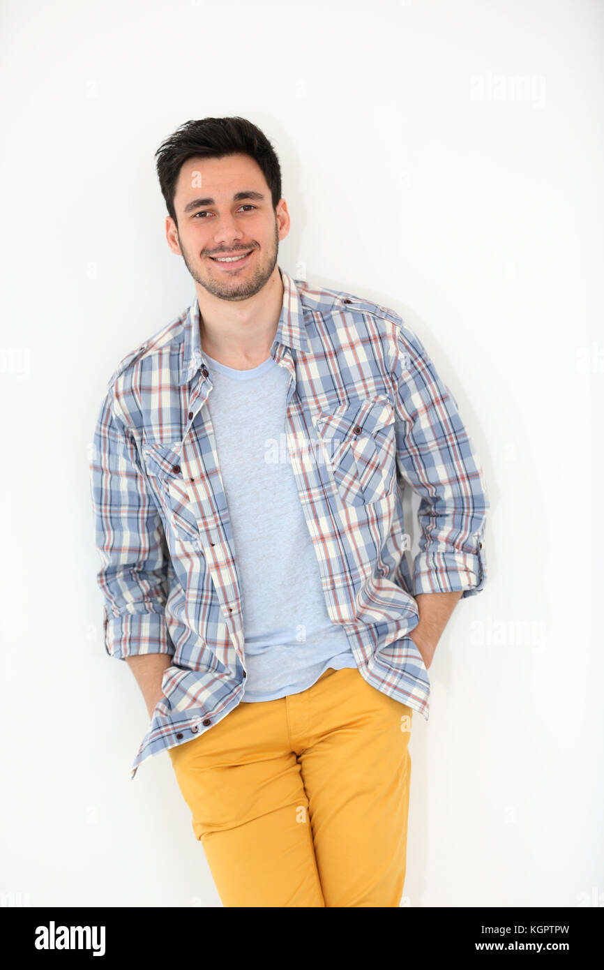 Trendy guy standing on white background Stock Photo - Alamy