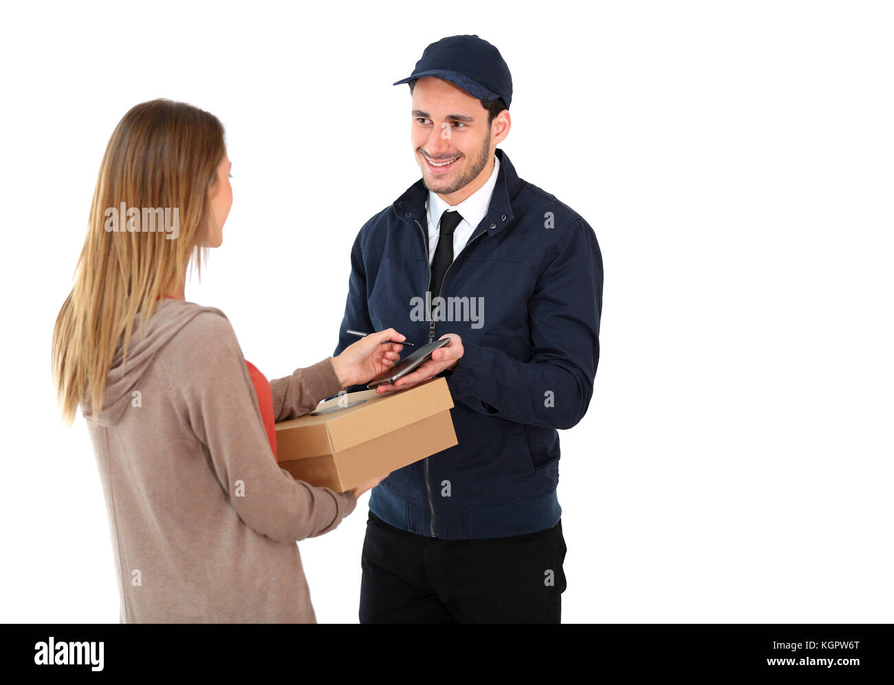 Woman signing receipt of package delivery Stock Photo - Alamy