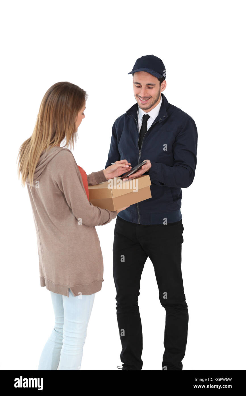 Woman signing receipt of package delivery Stock Photo - Alamy