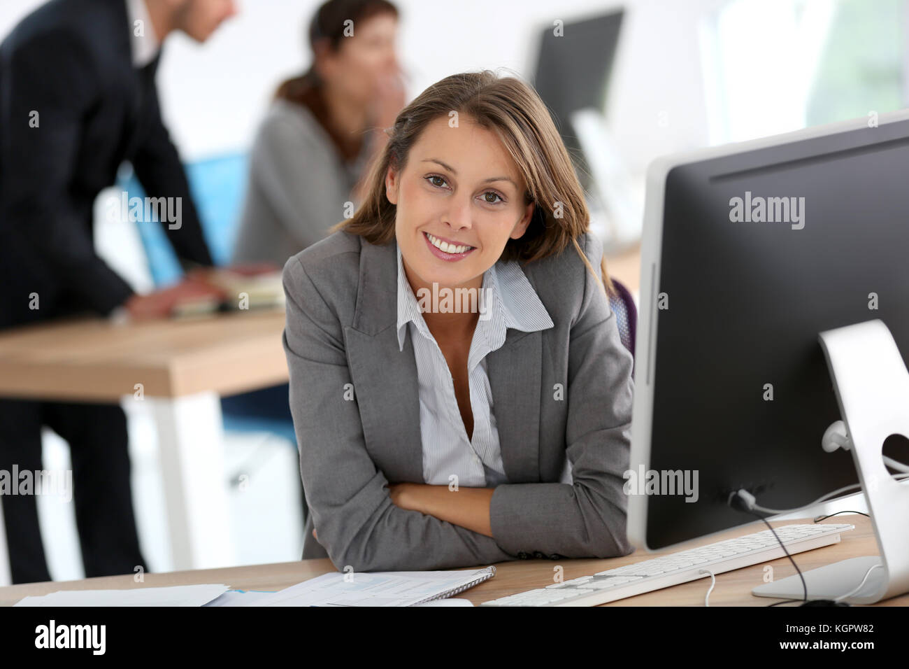 Businesswoman working on desktop computer Stock Photo - Alamy