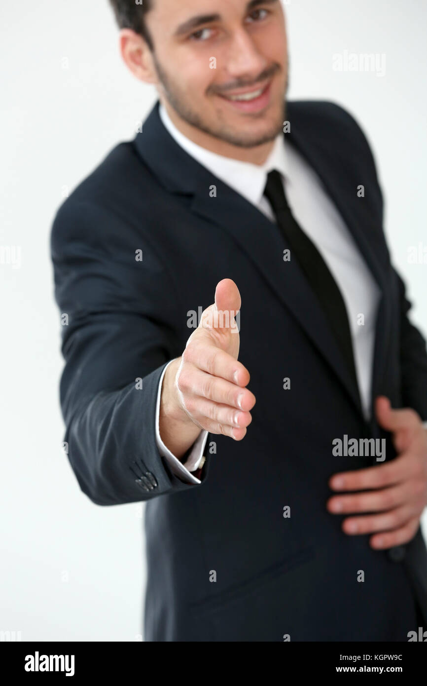 Closeup of businessman giving handshake Stock Photo - Alamy