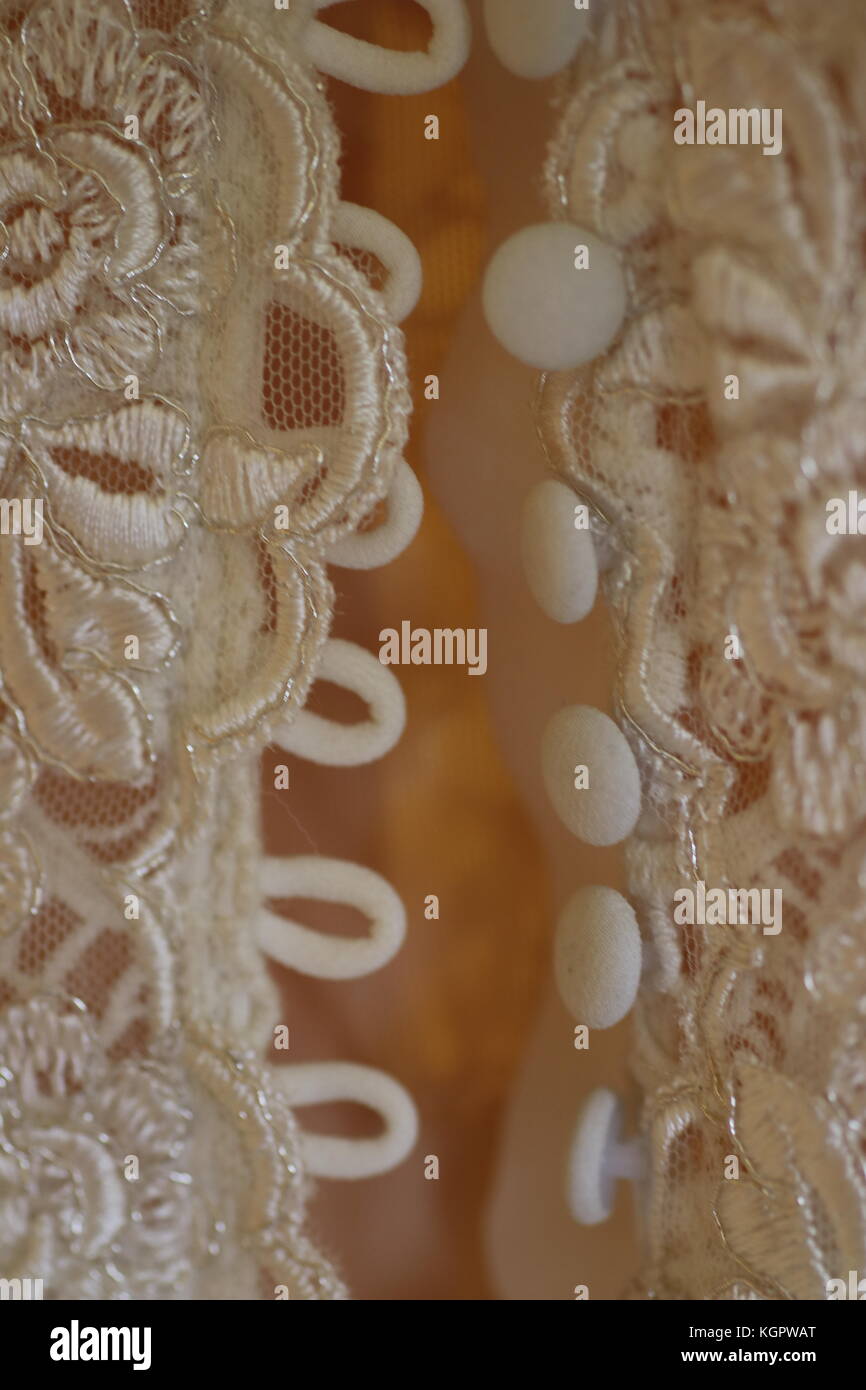 Wedding dress lace and buttons Stock Photo - Alamy