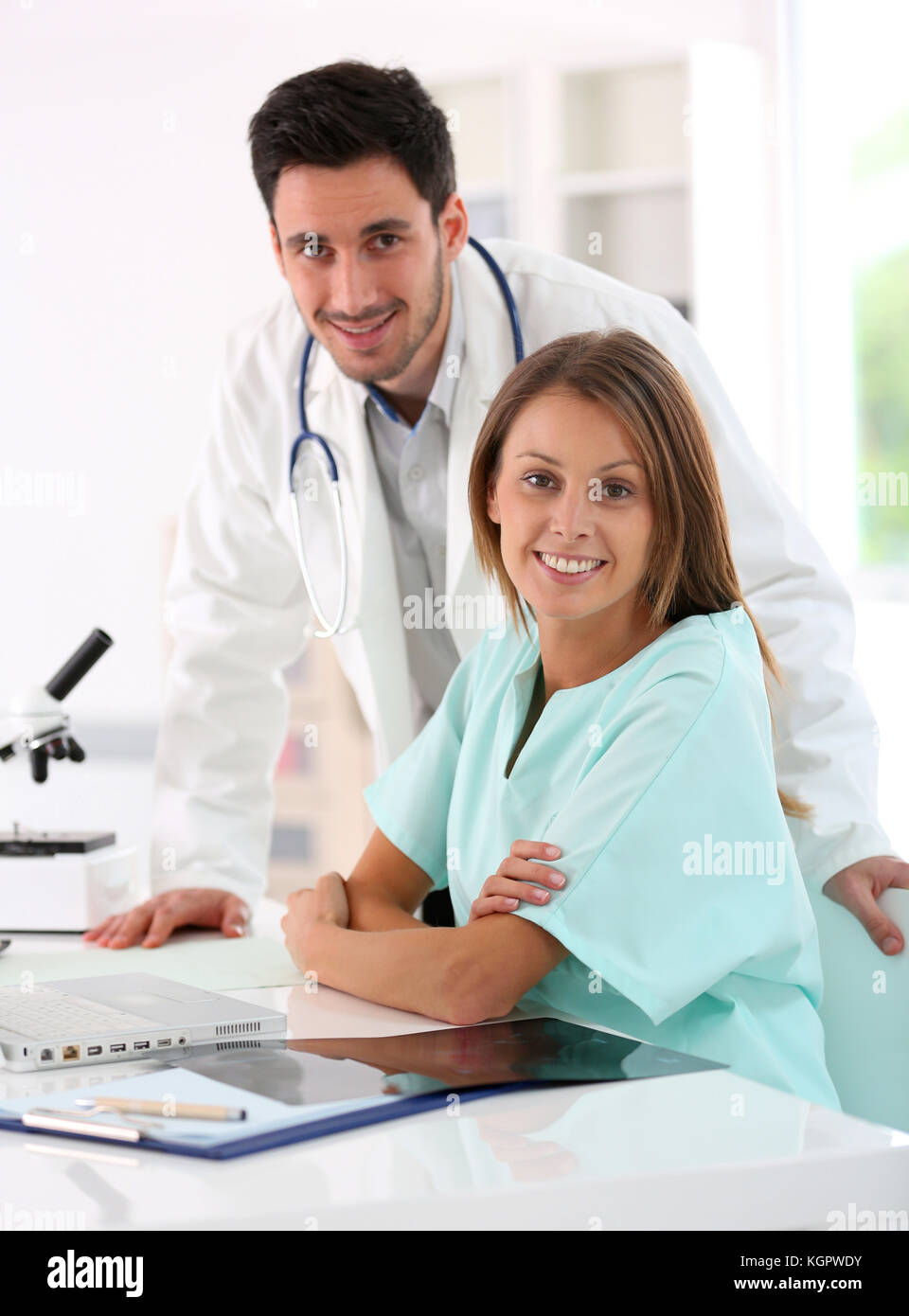 Doctor with nurse working together Stock Photo - Alamy