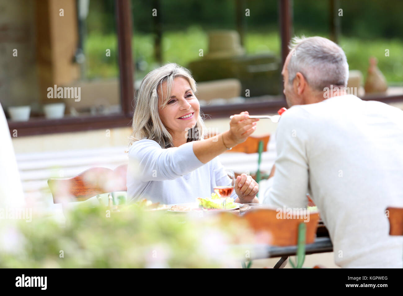 Senior man and woman having dinner home hi-res stock photography and ...