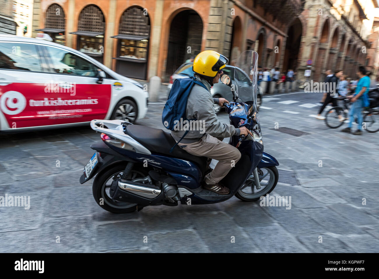 Motorcycle and scooter commuting. Bologna city life, Italy Stock Photo ...