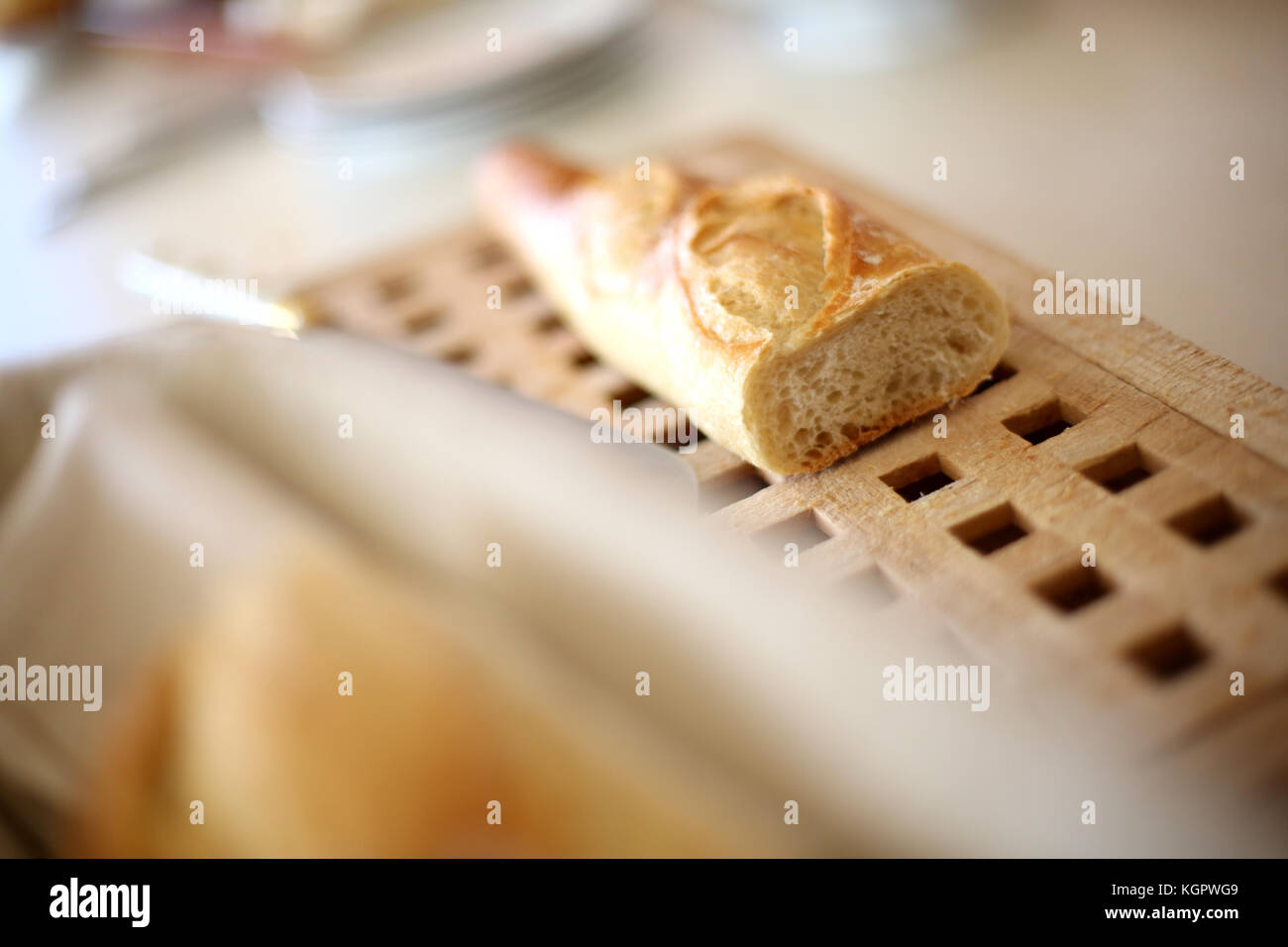 French bread set on wooden board Stock Photo - Alamy