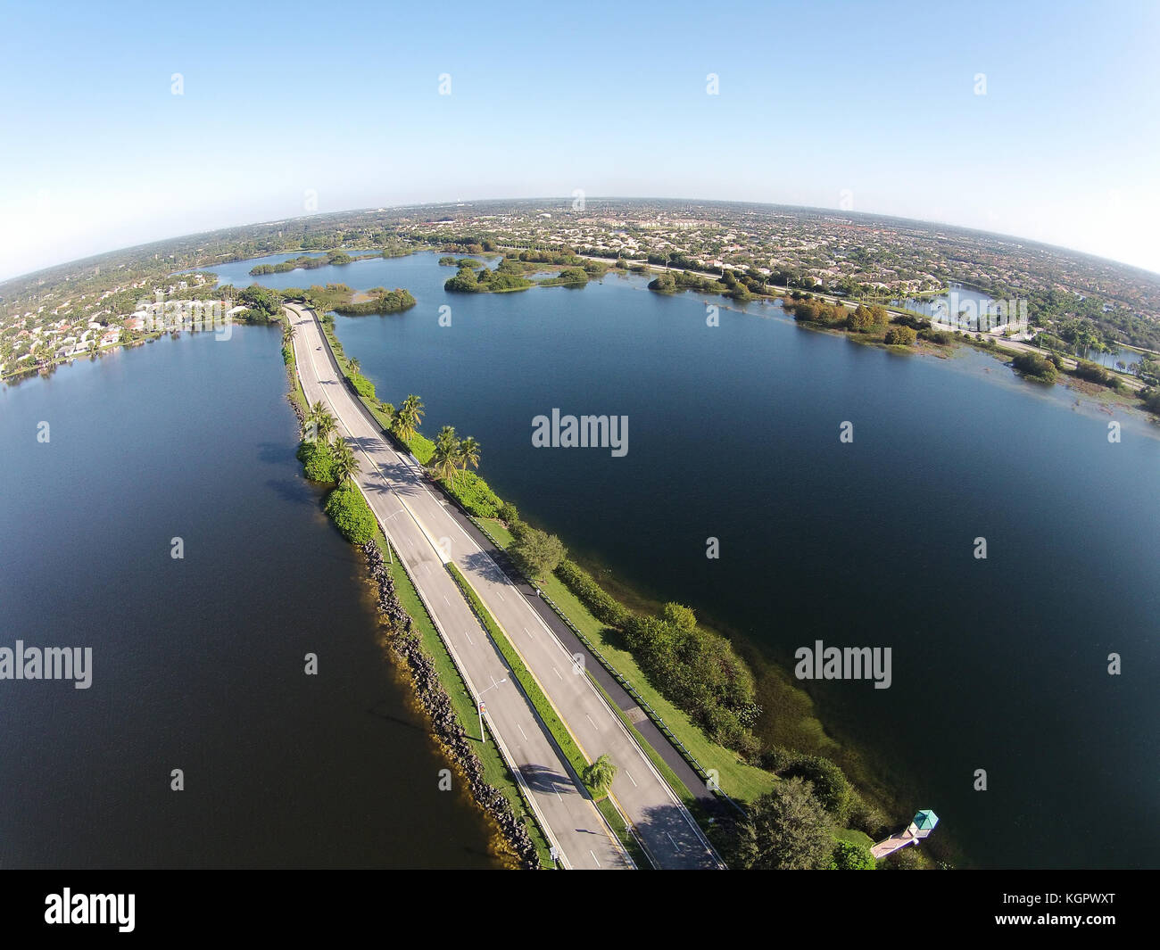 Suburban road crossing a Florida lake seen from above Stock Photo - Alamy