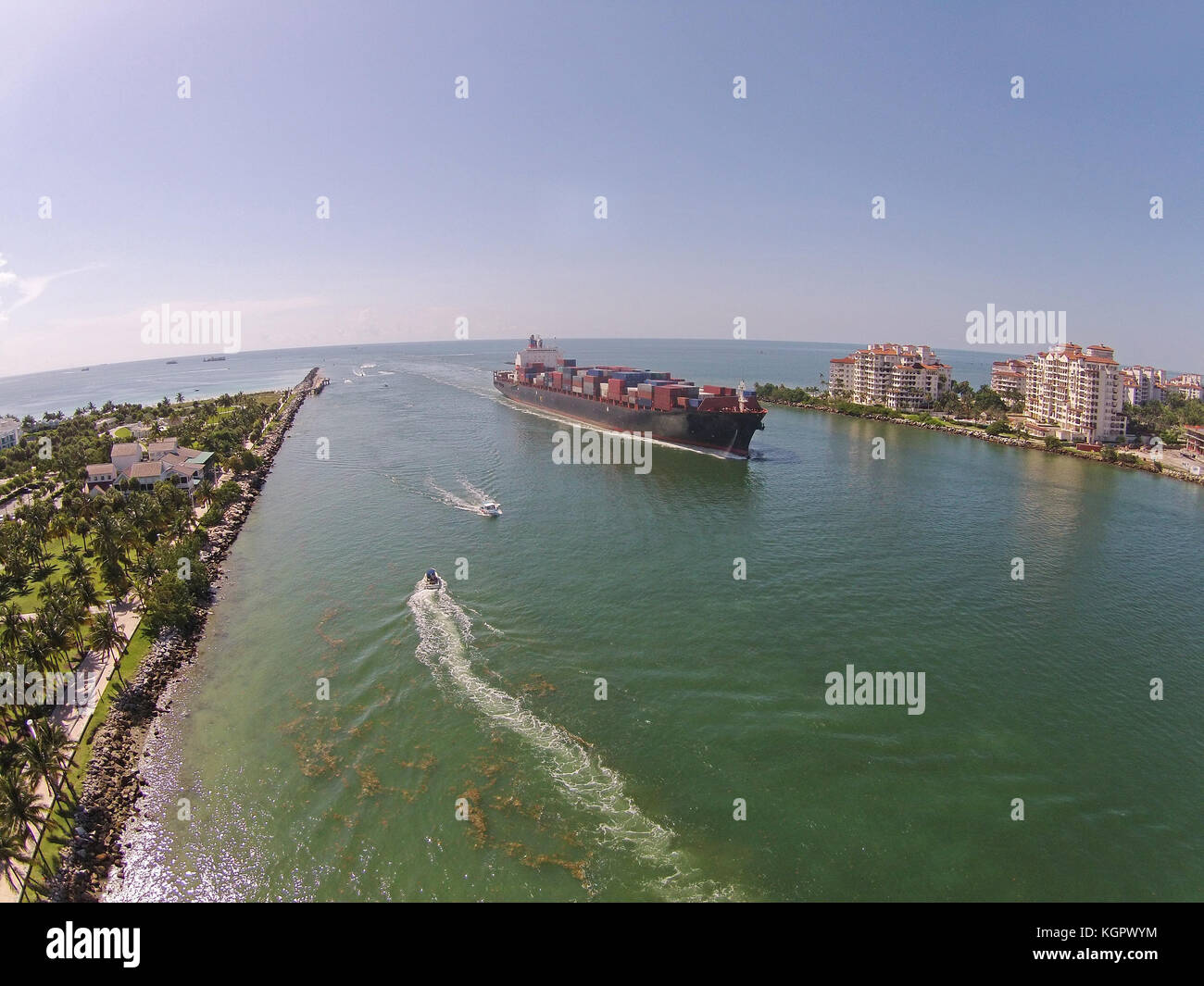 Cargo ship enters the Port of Miami seen from above Stock Photo - Alamy