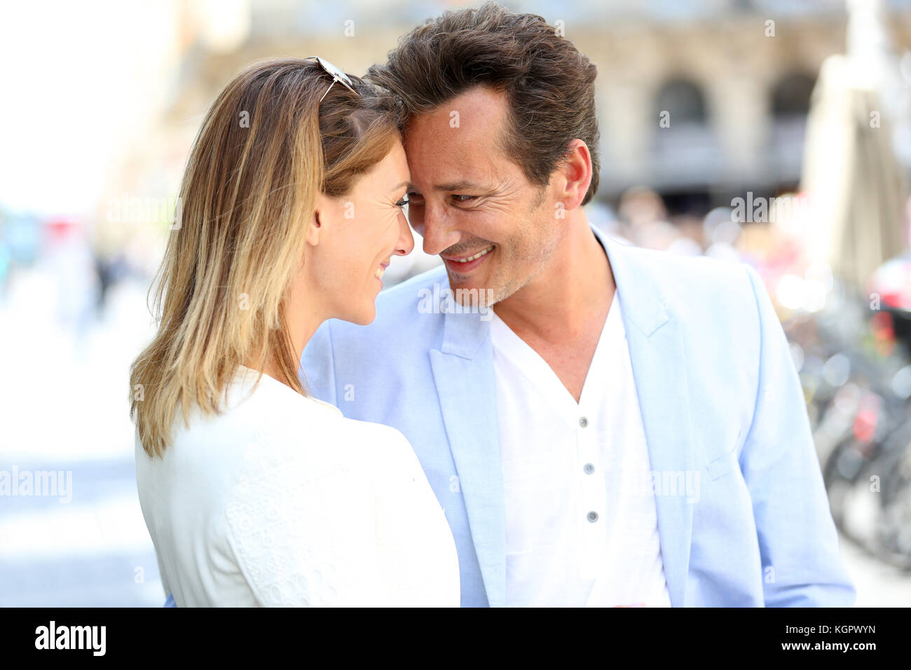 Fancy romantic couple in town embracing each other Stock Photo - Alamy